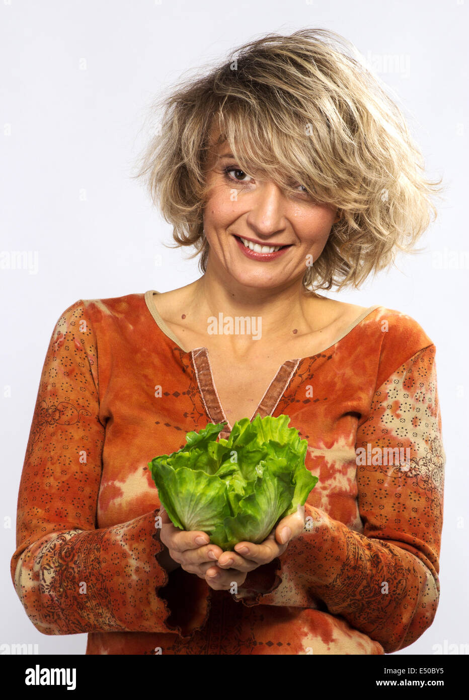 Beautiful woman with green cabbage Stock Photo - Alamy