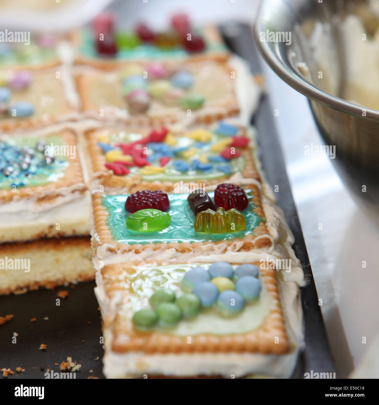Fun cakes with decorative candy toppings Stock Photo - Alamy