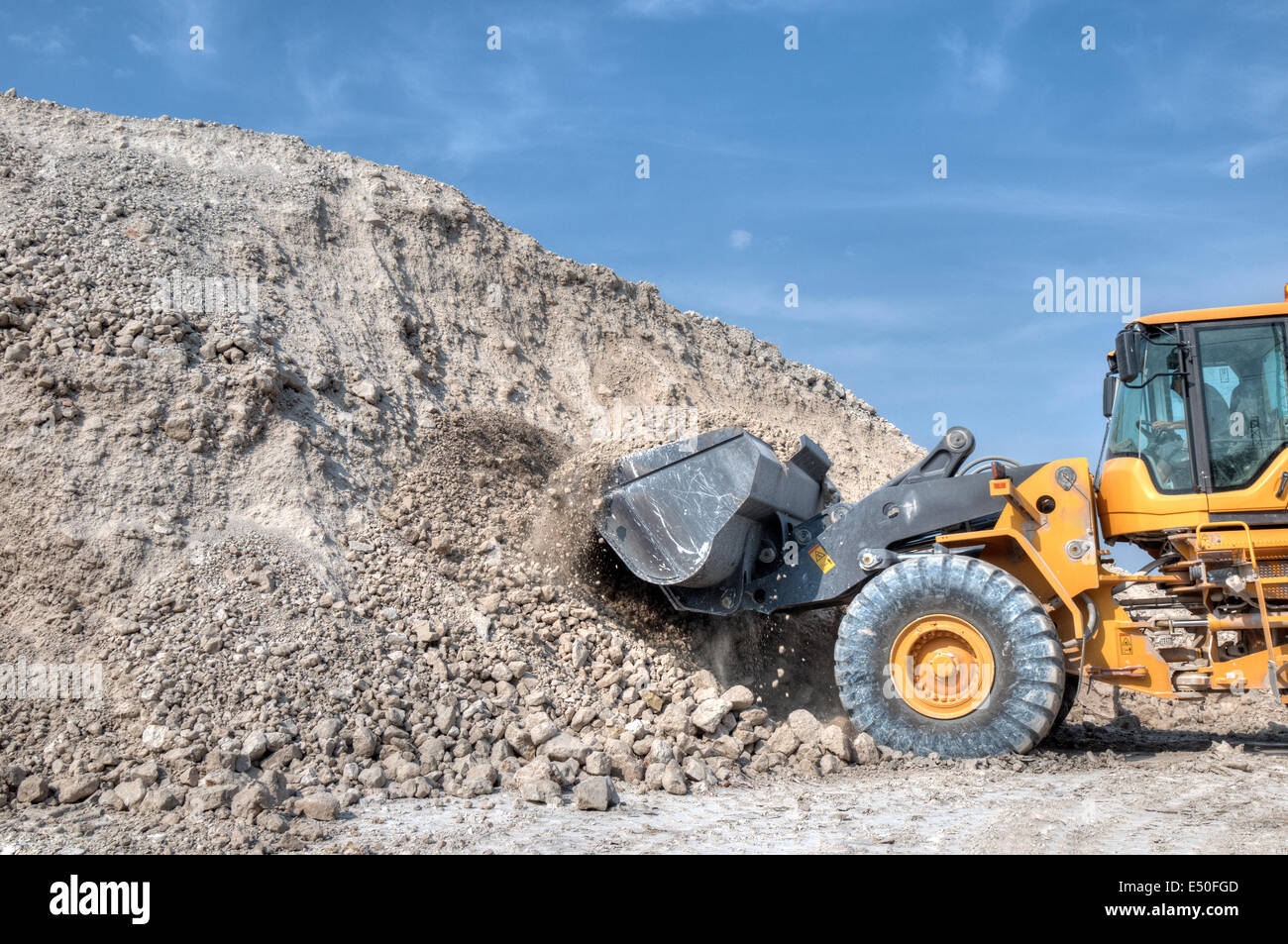 Excavator loader with backhoe works Stock Photo - Alamy