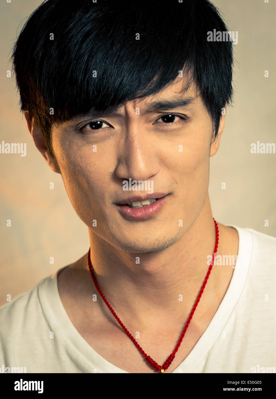 Young man looking angry Stock Photo - Alamy