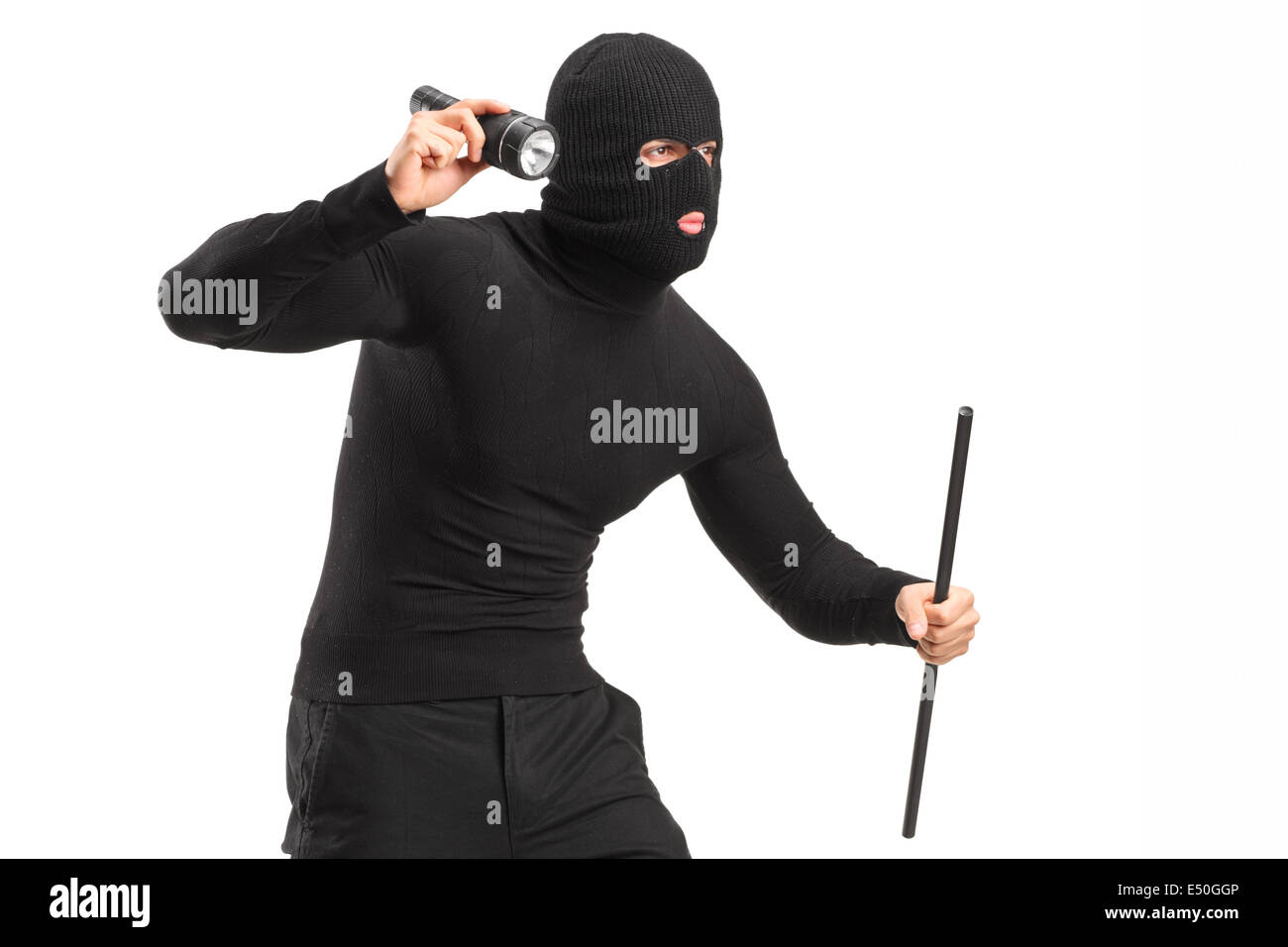 Robber with mask holding a flashlight and piece of pipe Stock Photo - Alamy