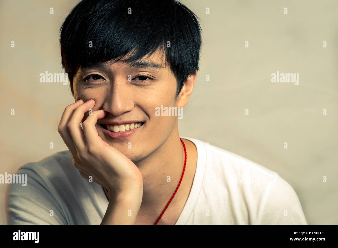 Young man smiling Stock Photo - Alamy