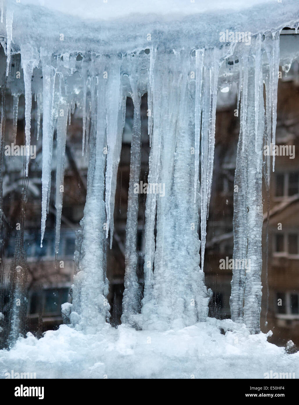 Frozen window with icicle on it Stock Photo - Alamy