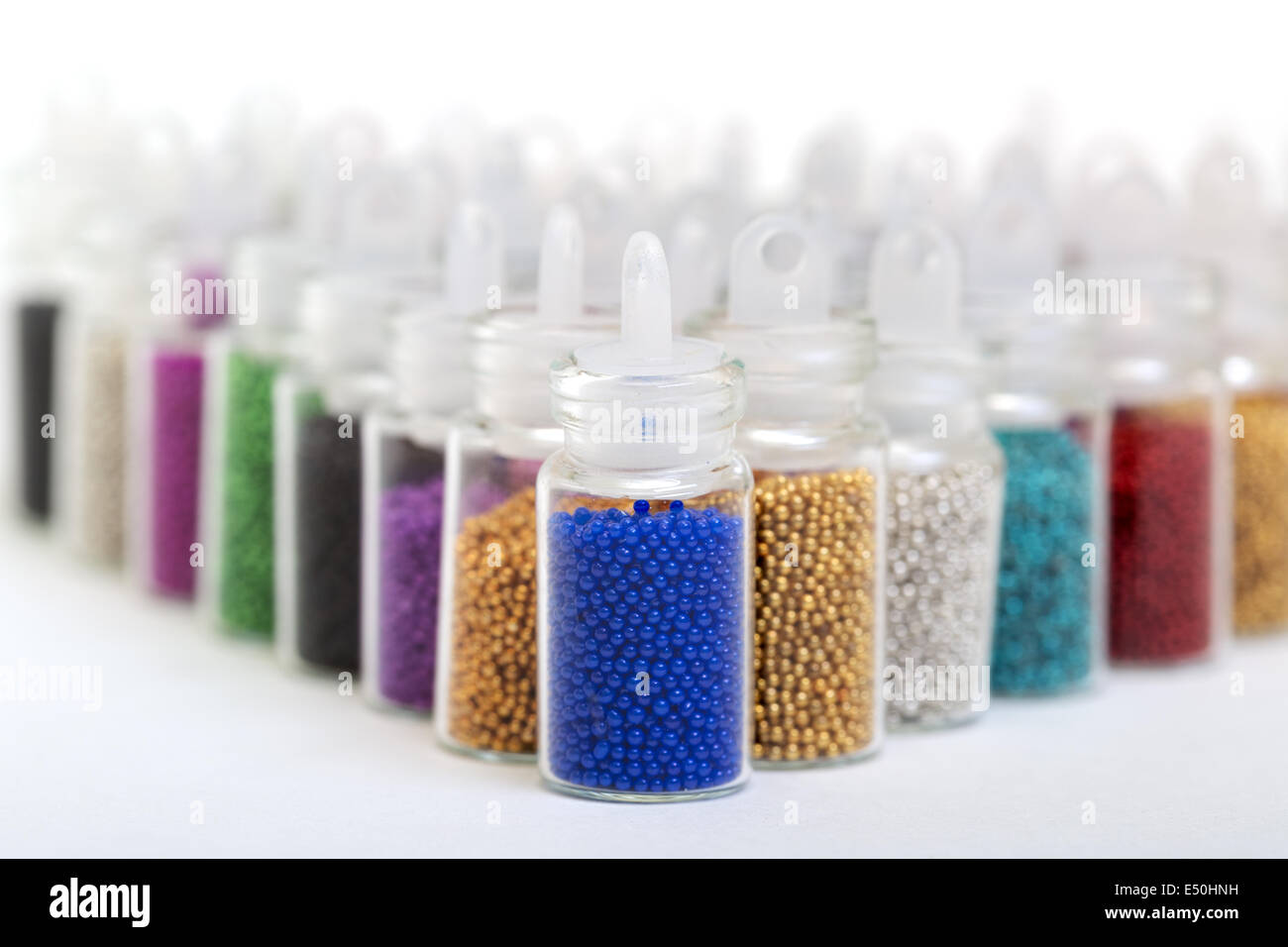 Small Glass Jars filled with Balls of Bead Stock Photo - Alamy