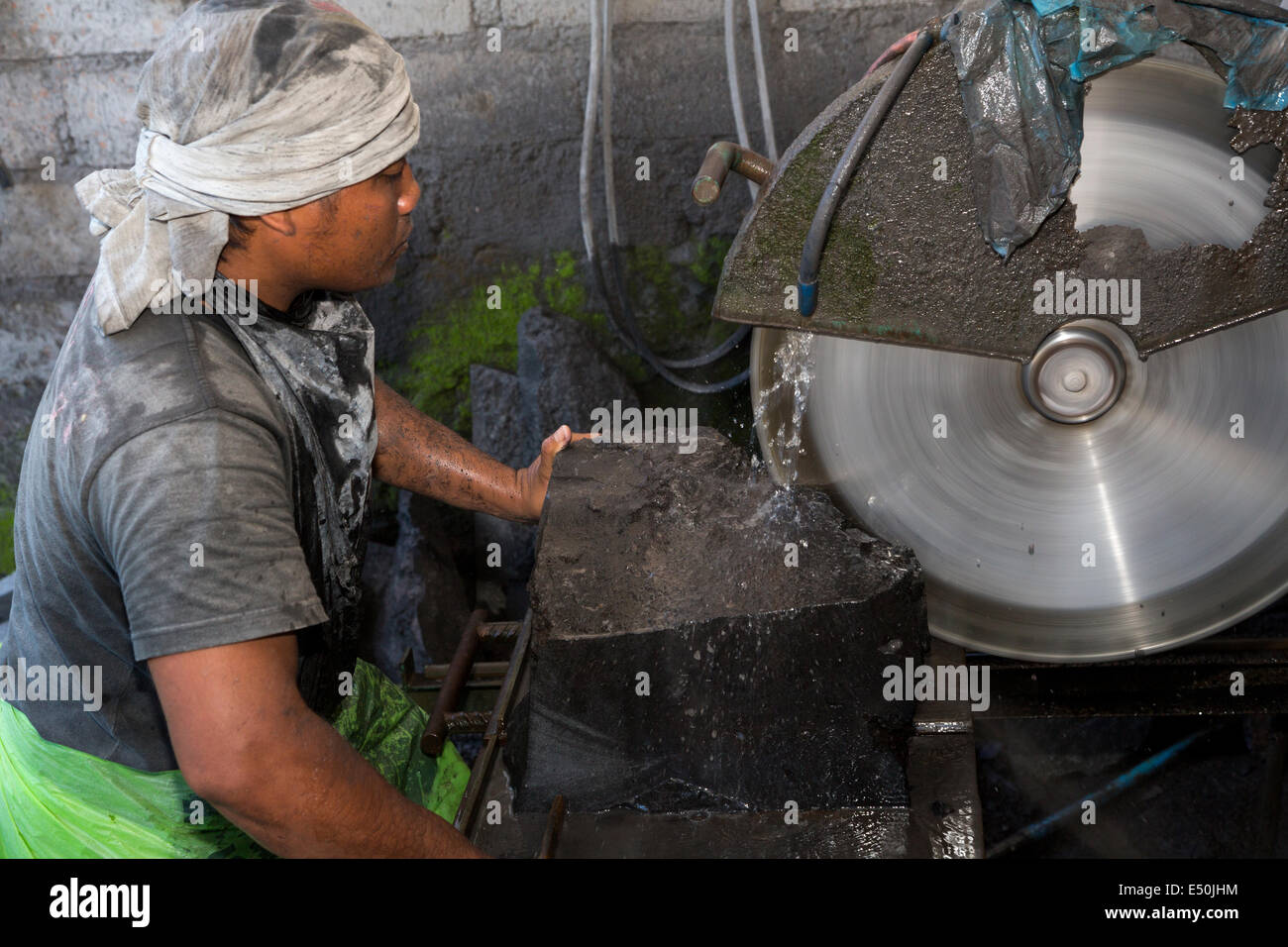 Bali, Indonesia. Stonecutter at Work Cutting Stone for Making Religious Shrines Stock Photo - Alamy