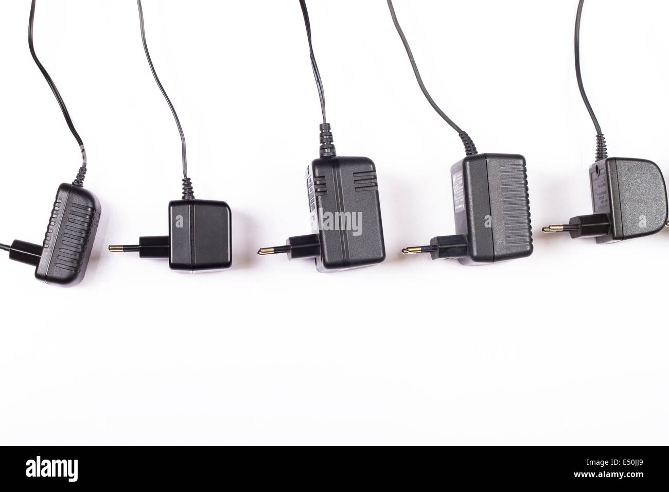 A cell phone chargers on white background Stock Photo - Alamy
