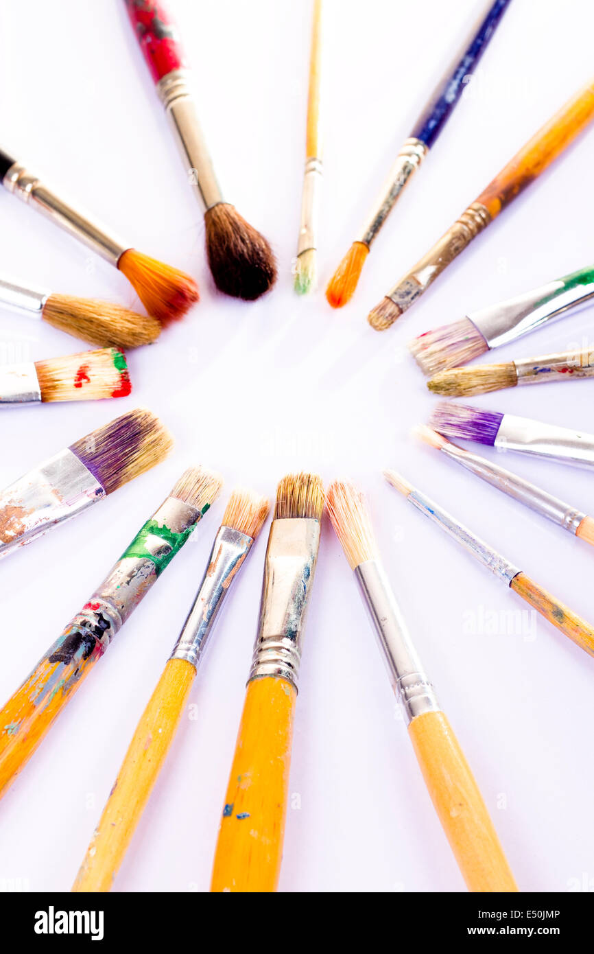 Used paint brushes of different colors Stock Photo - Alamy
