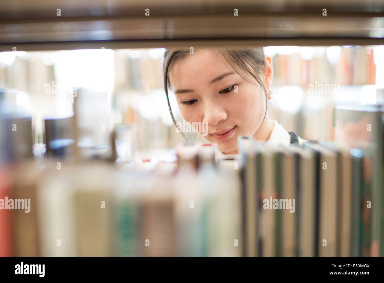 Bookshelf woman book hi-res stock photography and images - Alamy