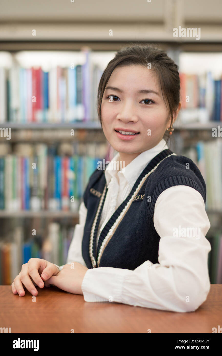 Student resting on wooden shelf Stock Photo - Alamy
