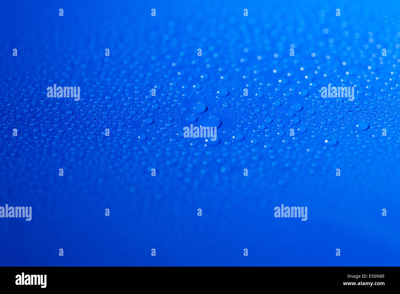 water drops on blue background Stock Photo - Alamy