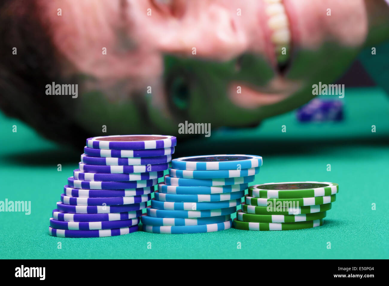 Chips on the background of a man's face Stock Photo - Alamy