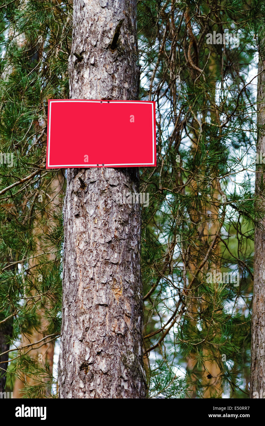Empty red sign on a tree Stock Photo - Alamy