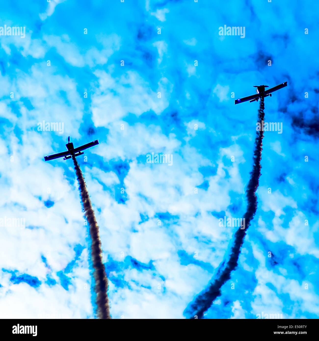 Planes in blue sky Cut Out Stock Images & Pictures - Alamy