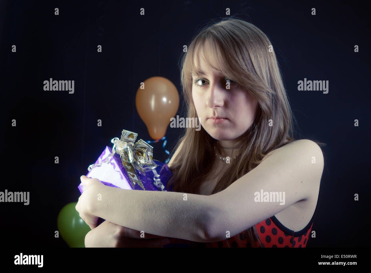 sad girl with a gift box Stock Photo - Alamy