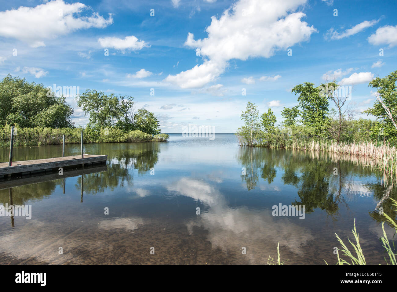 Landscape with lake and dock Stock Photo - Alamy