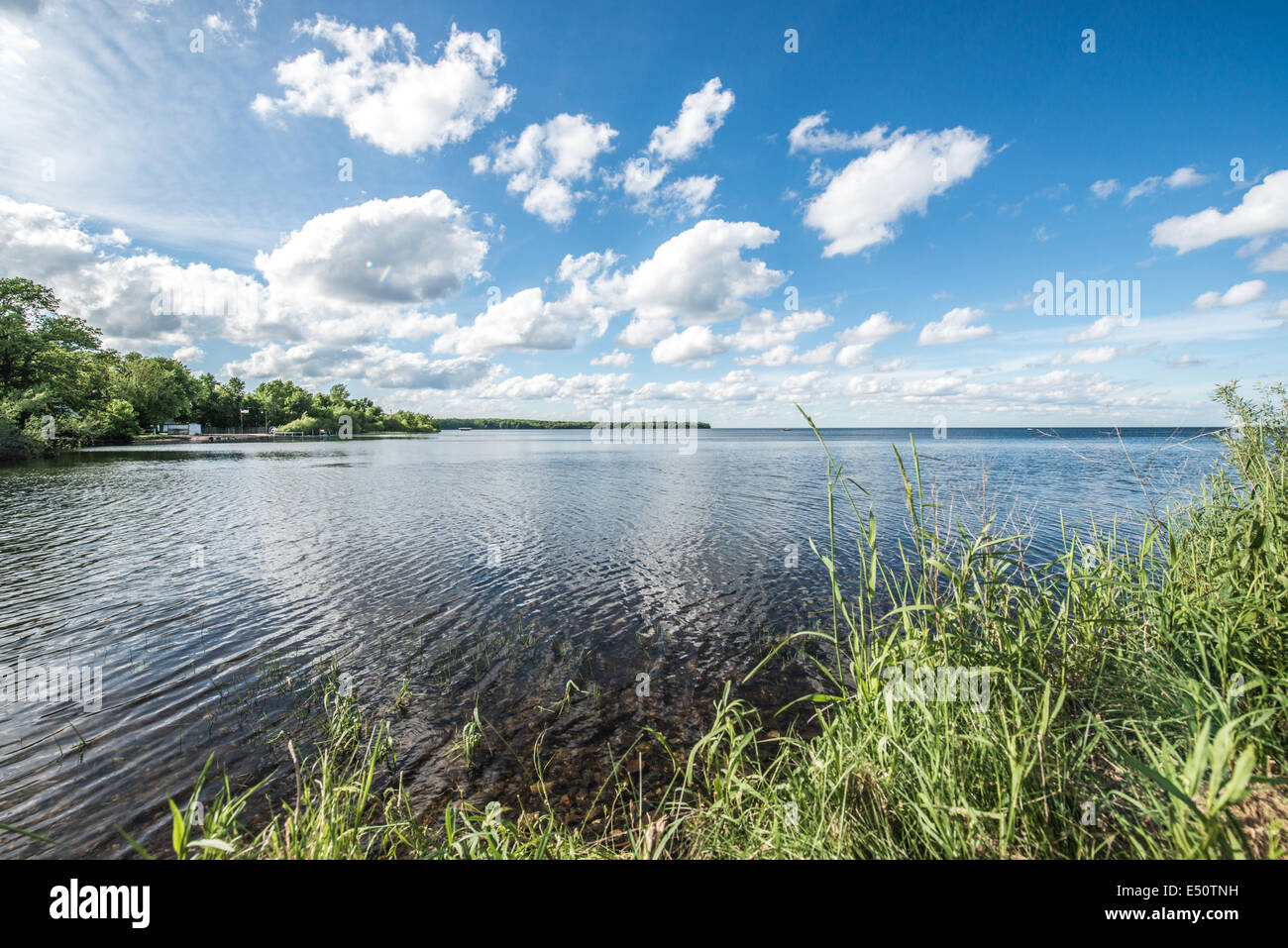 Landscape with lake and dock Stock Photo - Alamy