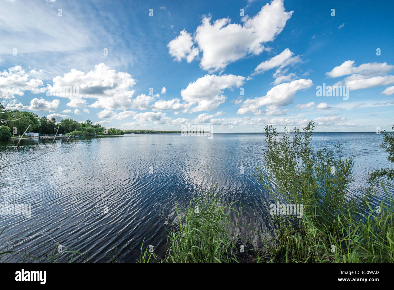 Landscape with lake and dock Stock Photo - Alamy