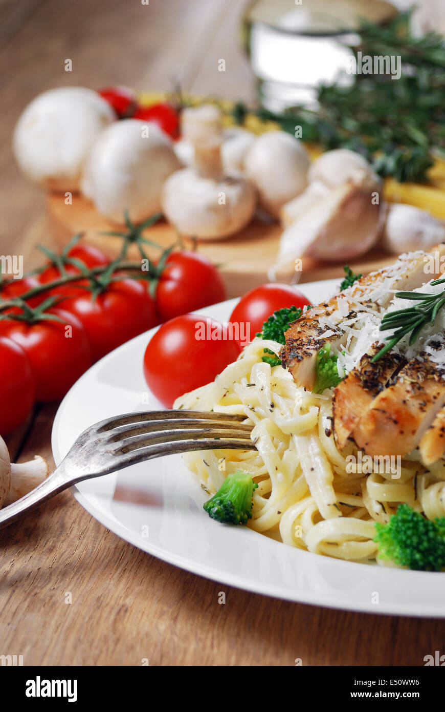 Pasta with fried chicken Stock Photo - Alamy