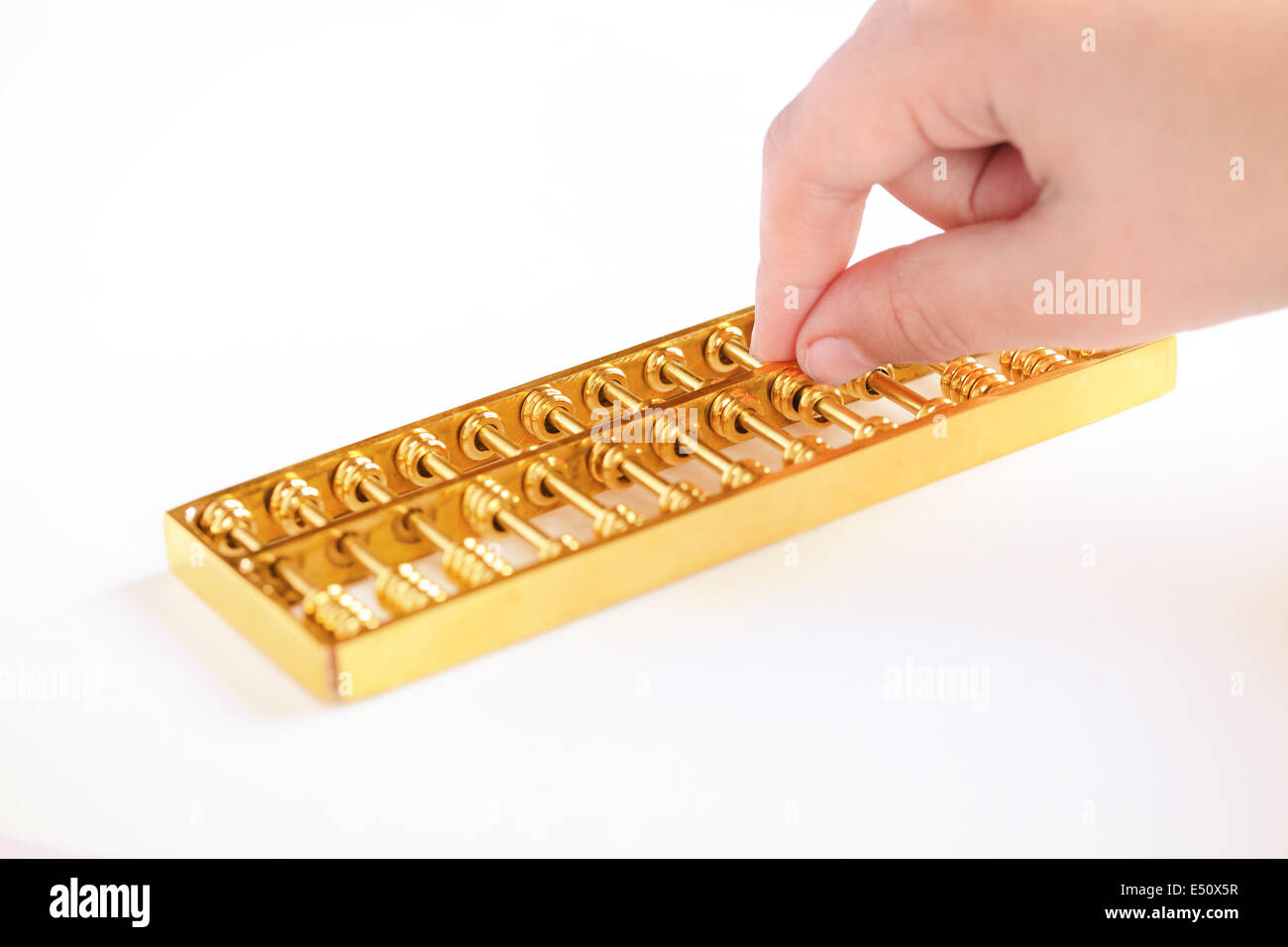 golden abacus and a hand Stock Photo - Alamy