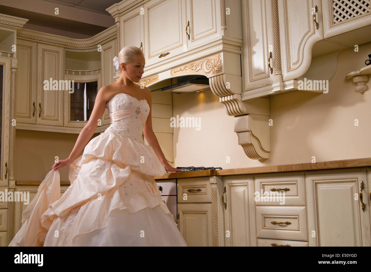 bride stands in the kitchen Stock Photo - Alamy