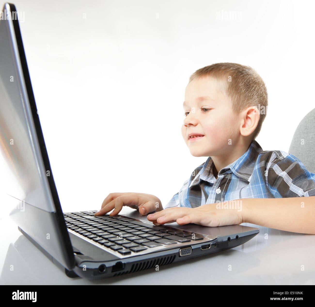Computer addiction child with laptop notebook Stock Photo - Alamy