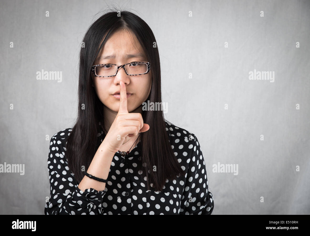 girl hand signals silence Stock Photo - Alamy