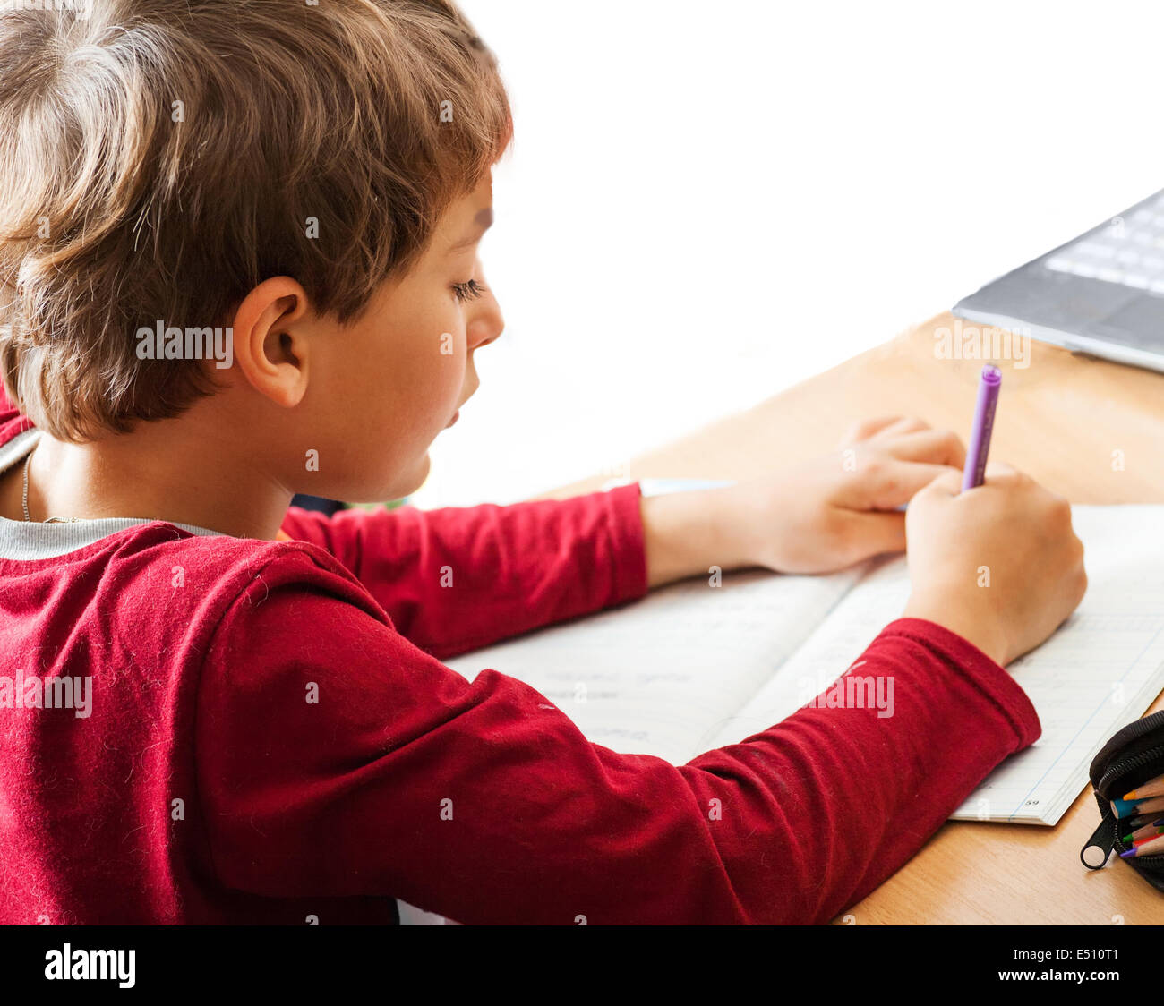 boy writing indoors Stock Photo - Alamy