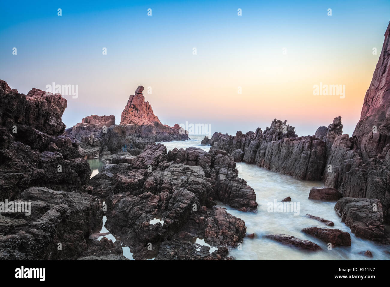 reef rock in sunrise Stock Photo - Alamy