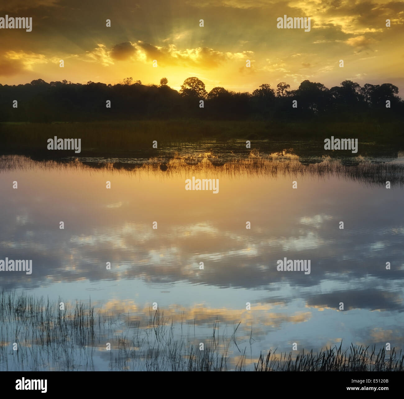 Sunset Over A Lake Stock Photo - Alamy
