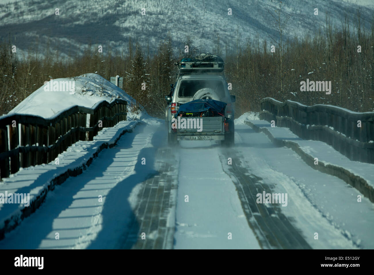 4WD expedition dangerous road bridge Siberia snow Stock Photo - Alamy