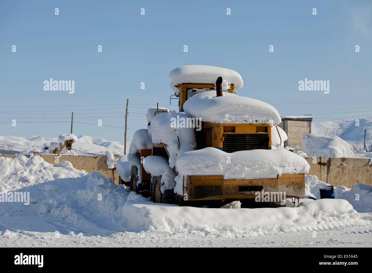 Snowplough covered in snow Stock Photo - Alamy