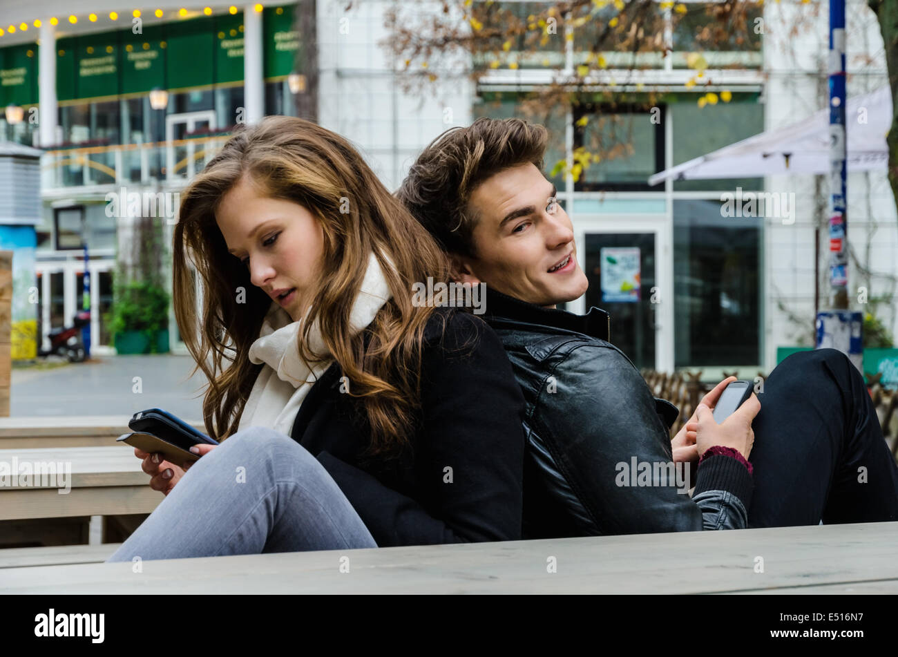 Two women sitting on bench hi-res stock photography and images - Alamy
