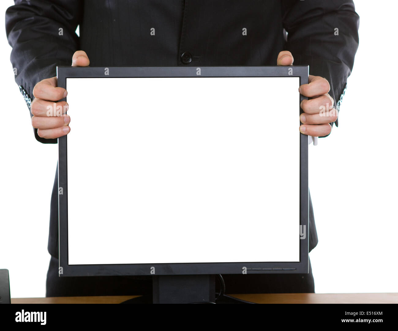Business man holding a computer monitor Stock Photo - Alamy
