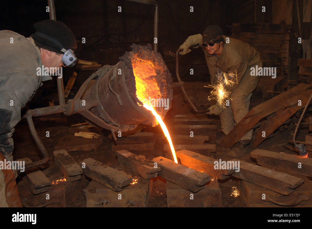 Molten steel pouring Stock Photo - Alamy