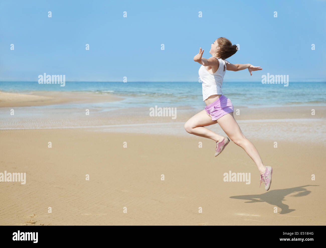 Woman stretch beach happy hi-res stock photography and images - Alamy