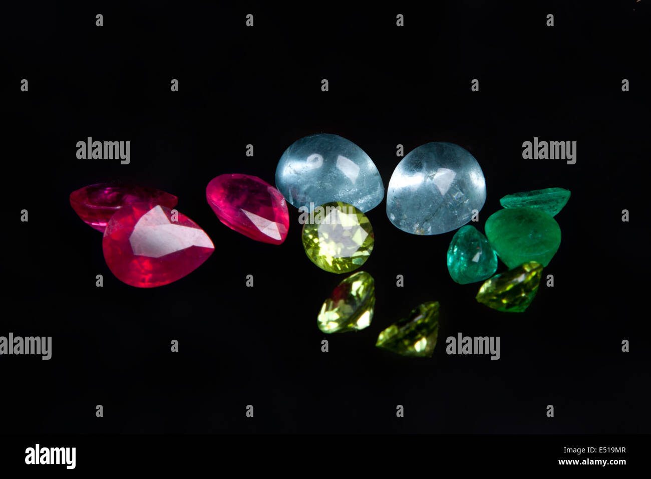colorful gems isolated on a black background Stock Photo - Alamy