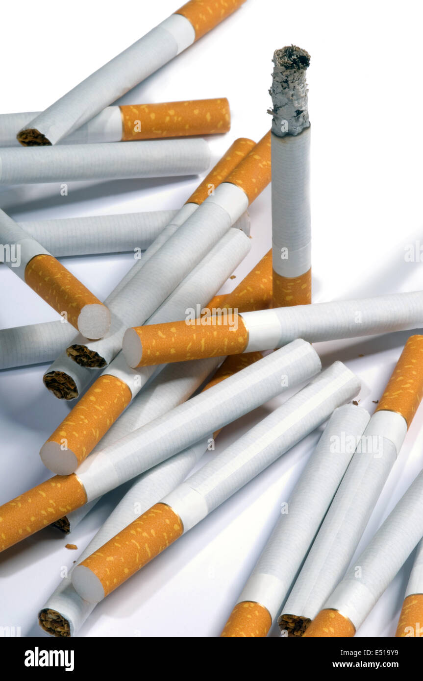 cigarettes lying on a white background Stock Photo - Alamy