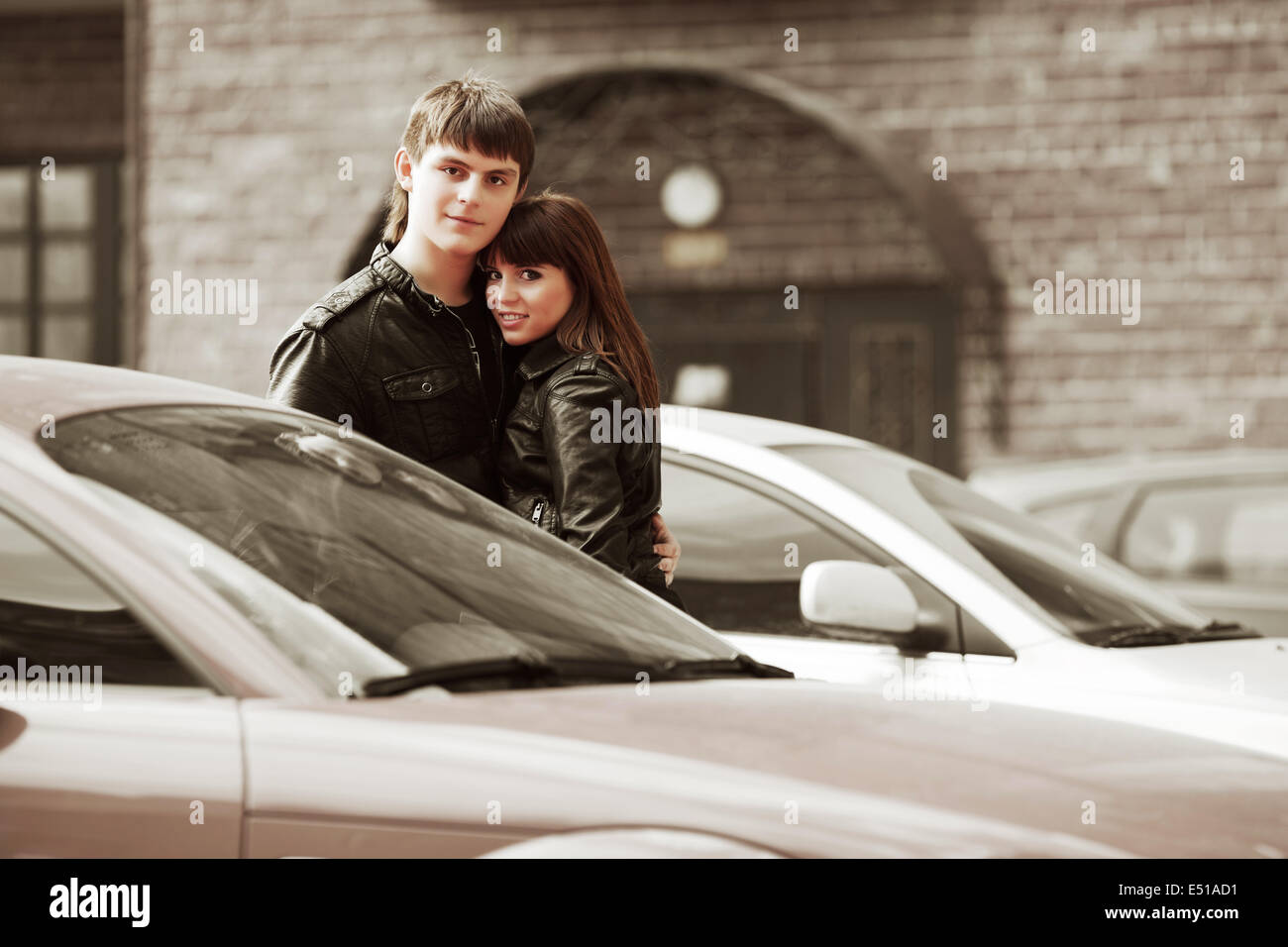 Happy young couple in love at the car Stock Photo - Alamy
