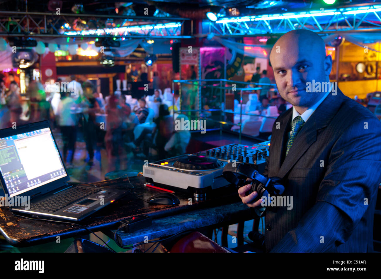 DJ behind the control panel Stock Photo - Alamy
