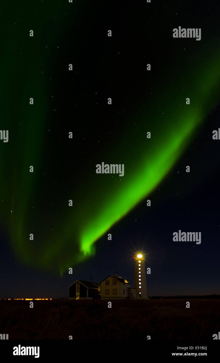 Lighthouse under northern lights Stock Photo - Alamy