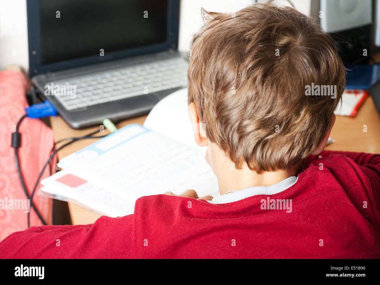 boy writing indoors Stock Photo - Alamy