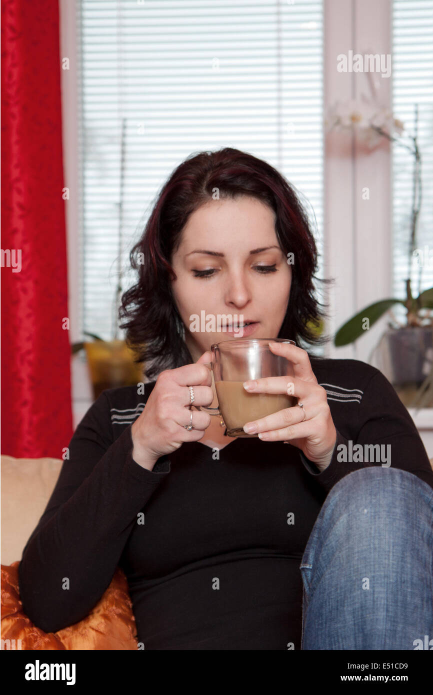 Woman drinking coffee Stock Photo - Alamy