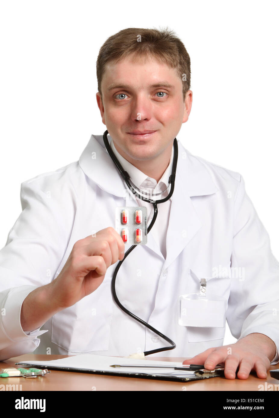 male doctor holding a pill on white Stock Photo - Alamy