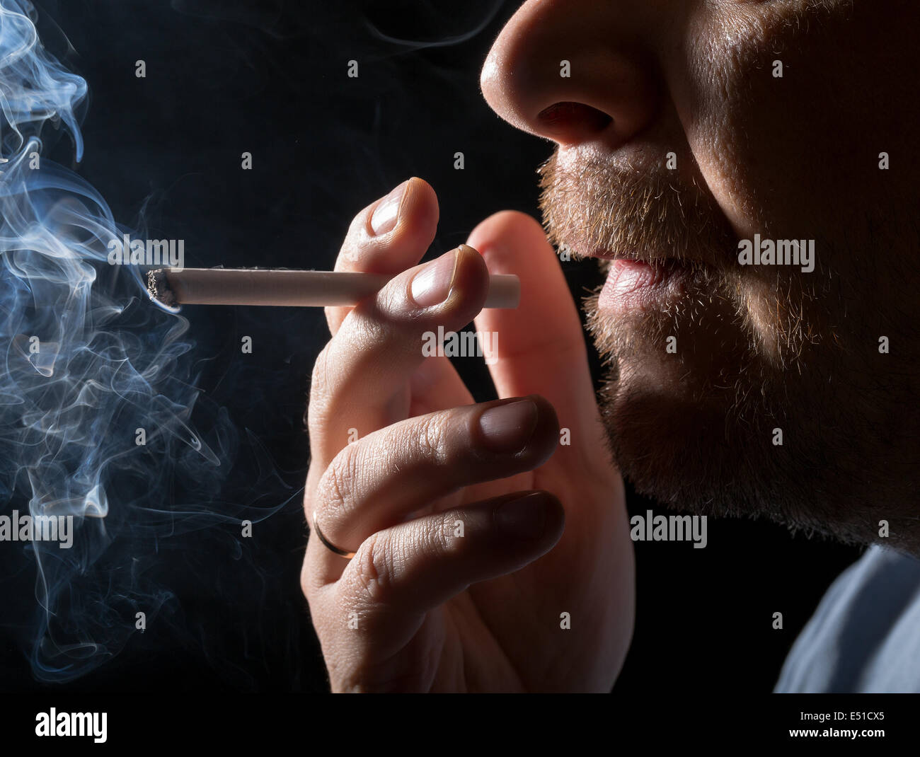 Portrait man smoking cigarette Stock Photo - Alamy