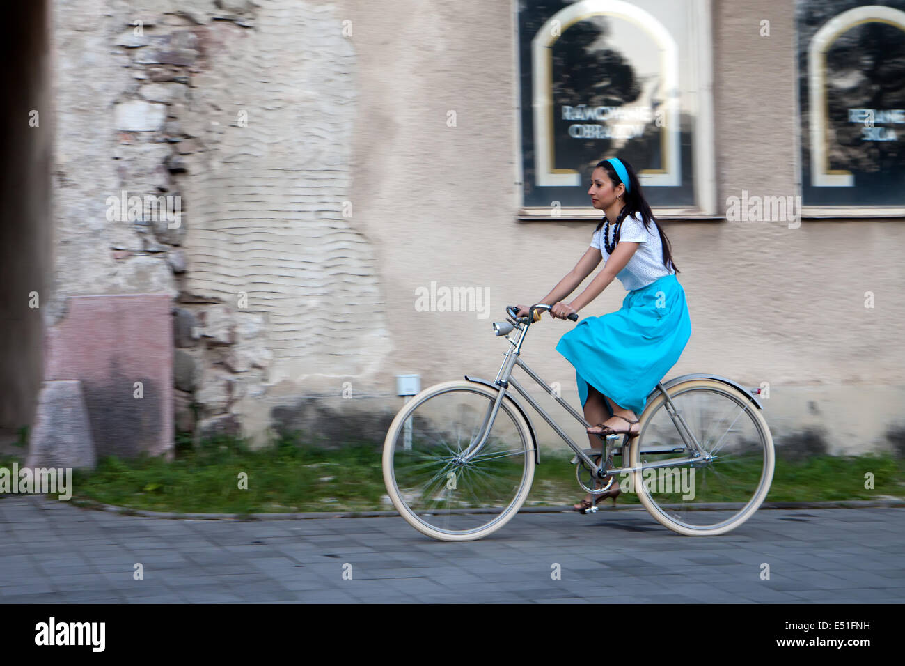Retro girl on bicycle hi-res stock photography and images - Alamy