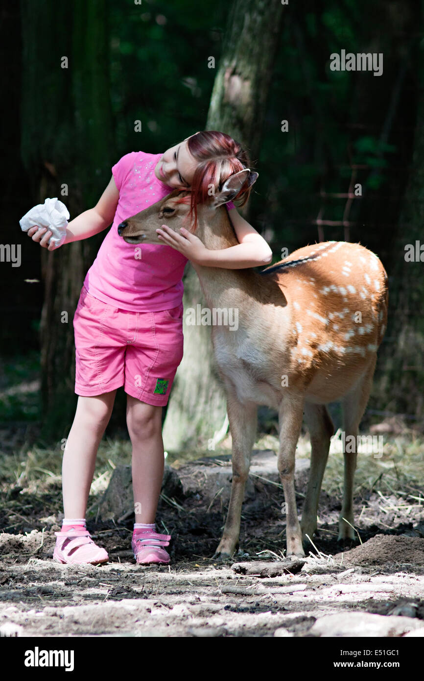 Girl and sika deer Stock Photo - Alamy