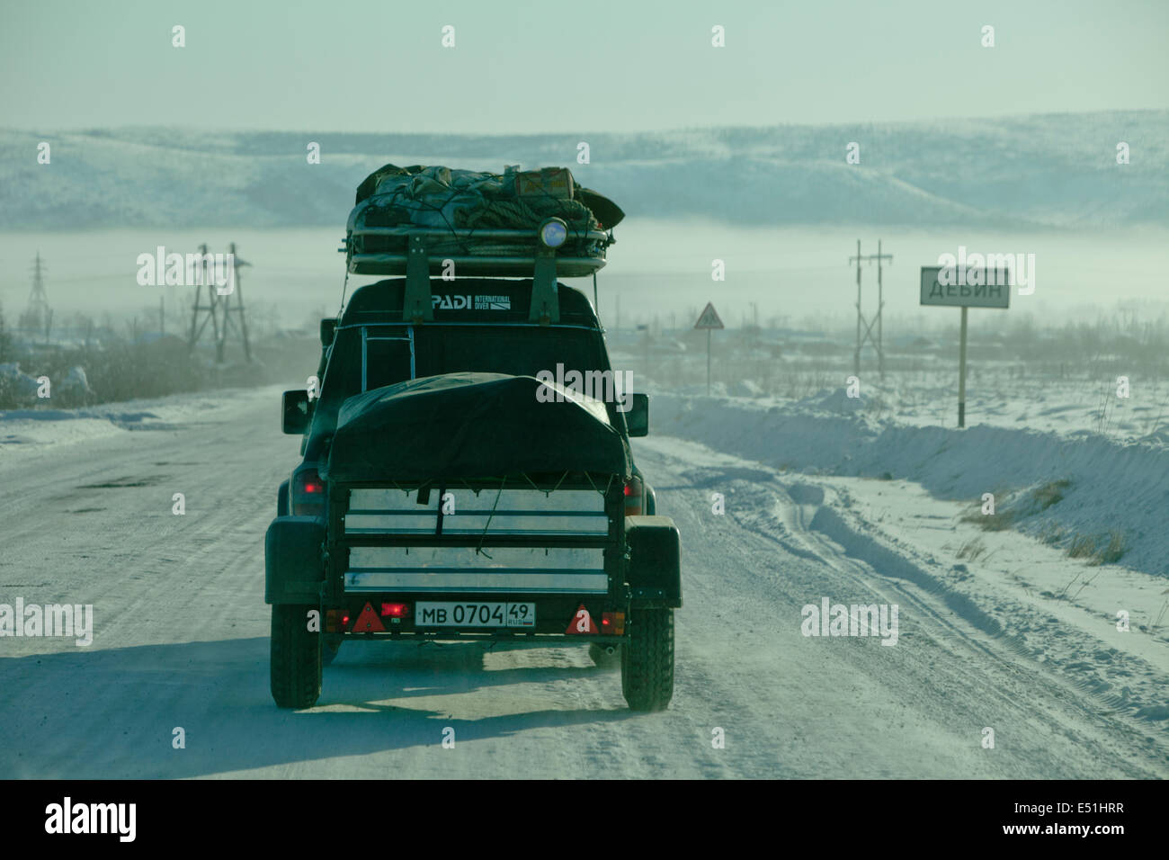 4WD expedition deserted snow road mountains Siberia Stock Photo - Alamy