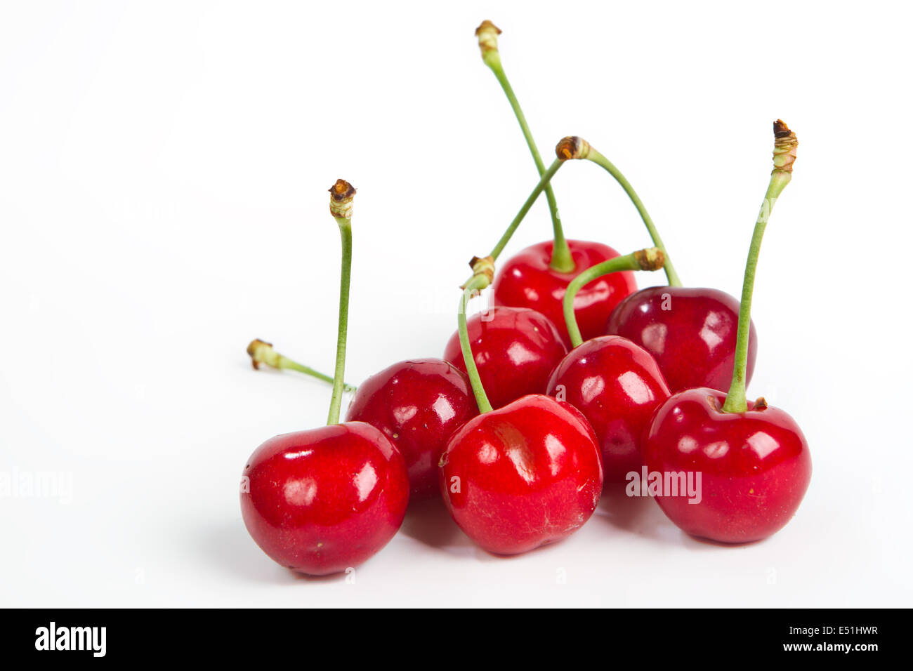 Ripe red cherries pink Cut Out Stock Images & Pictures - Alamy