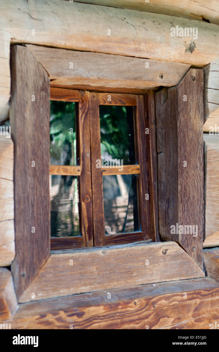 window in the wall of an old wooden house Stock Photo - Alamy