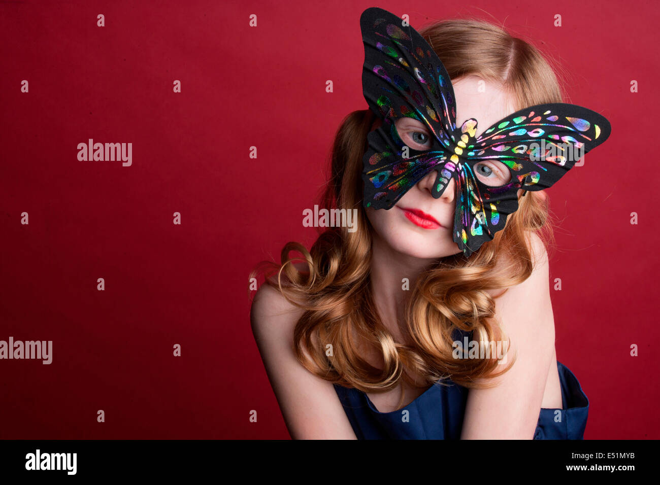 Portrait of teenage girl with butterfly mask Stock Photo - Alamy